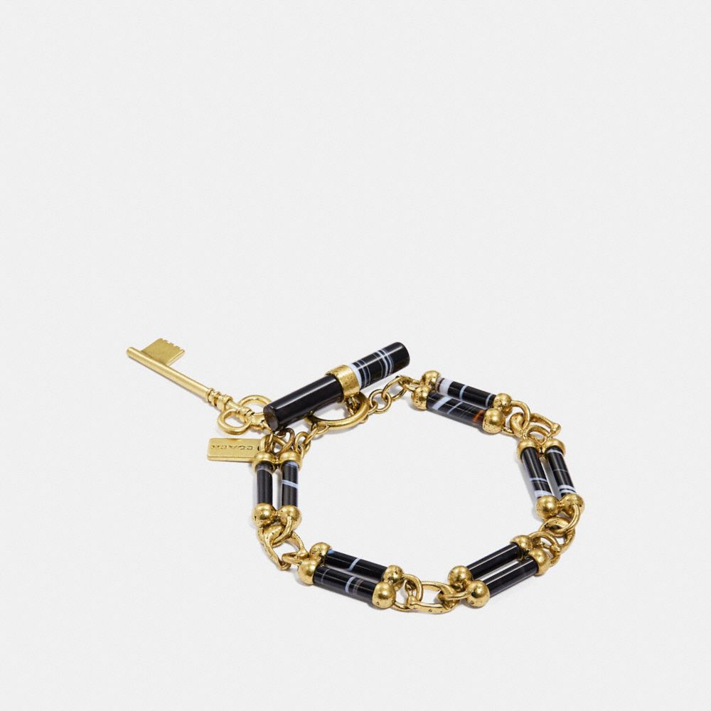 COACH®: Toggle Key Charm Bracelet