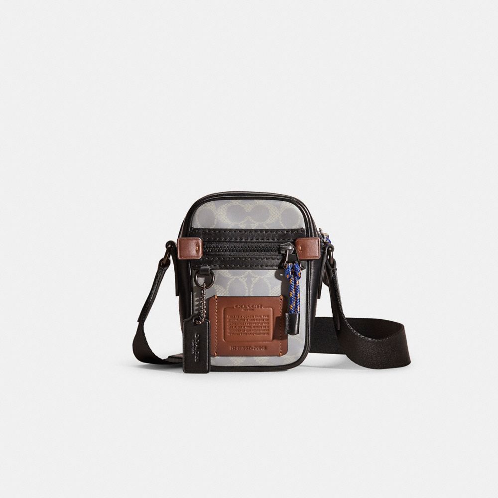 Coach Restored Dylan 10 In Reflective Signature Canvas In Black Copper ...