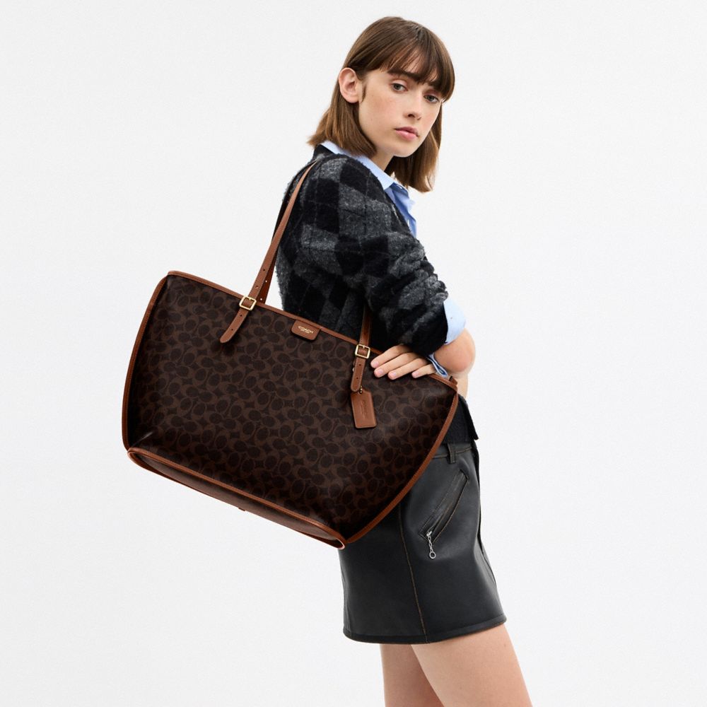 COACH® | Taxi Tote Bag In Signature Canvas